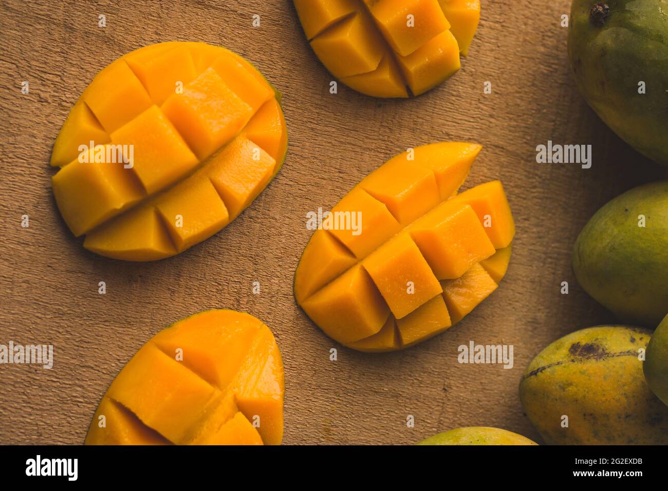Alphonso mango slices on wooden background stock image with selective ...