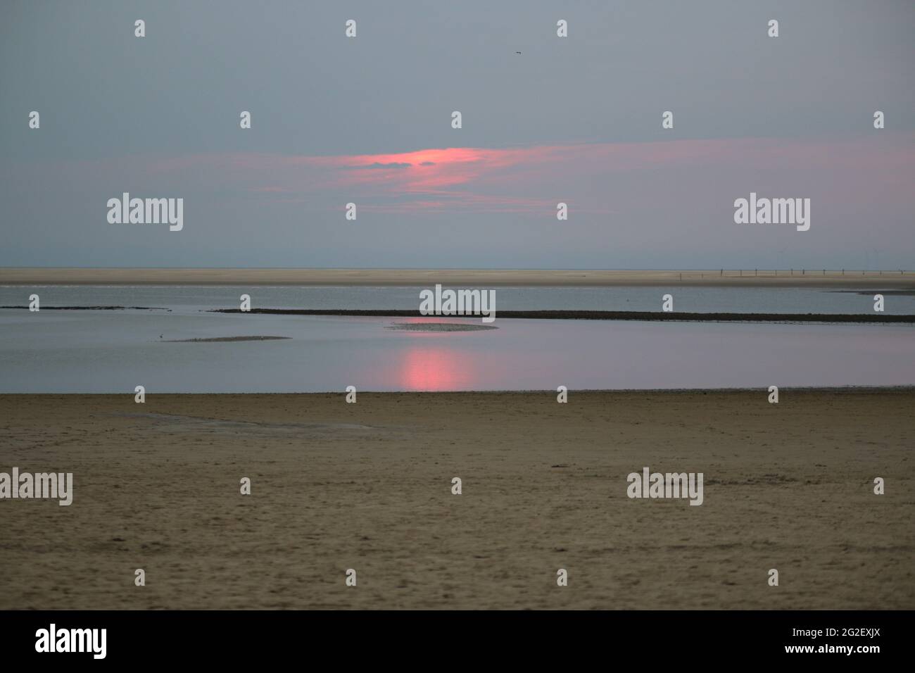 Sunset at a beach at the North Sea Stock Photo - Alamy