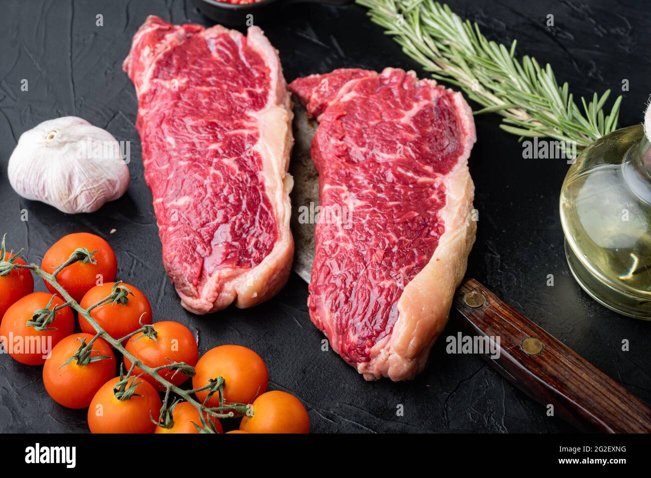 Sirloin steak, uncooked beef meat cut, on black background Stock Photo ...