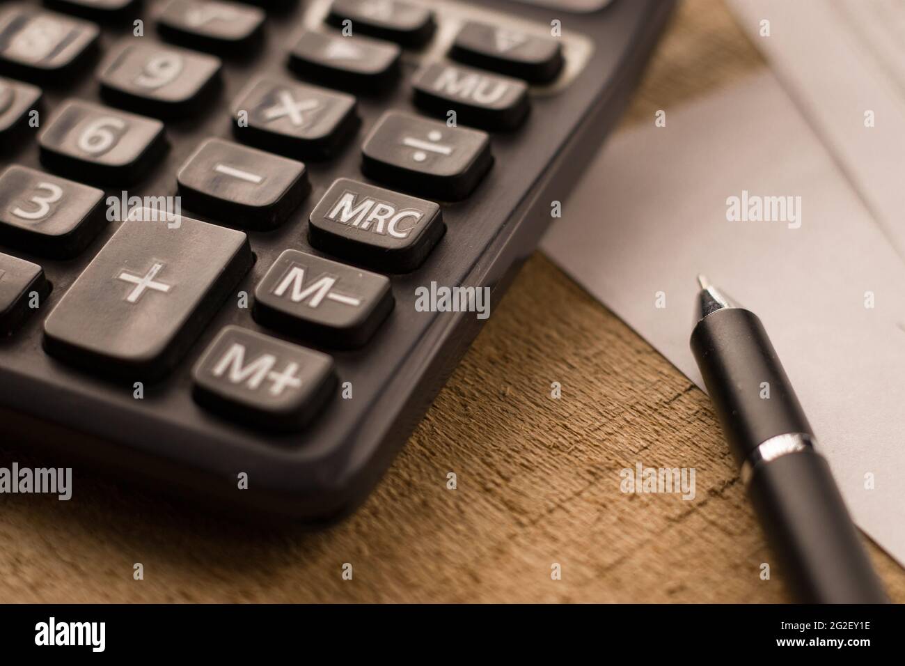 Black calculator on texture background stock image Stock Photo - Alamy