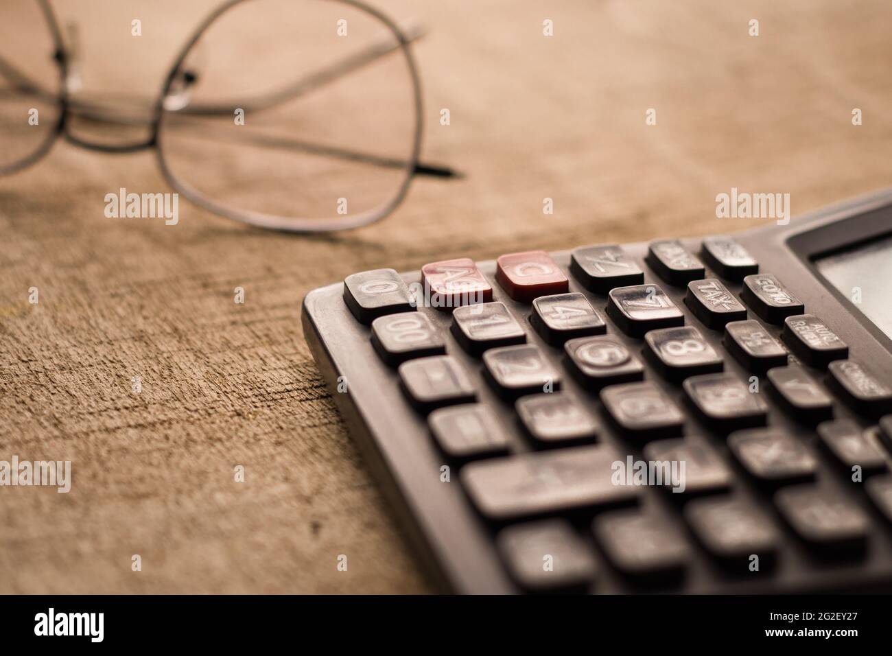 Black calculator on texture background stock image Stock Photo - Alamy
