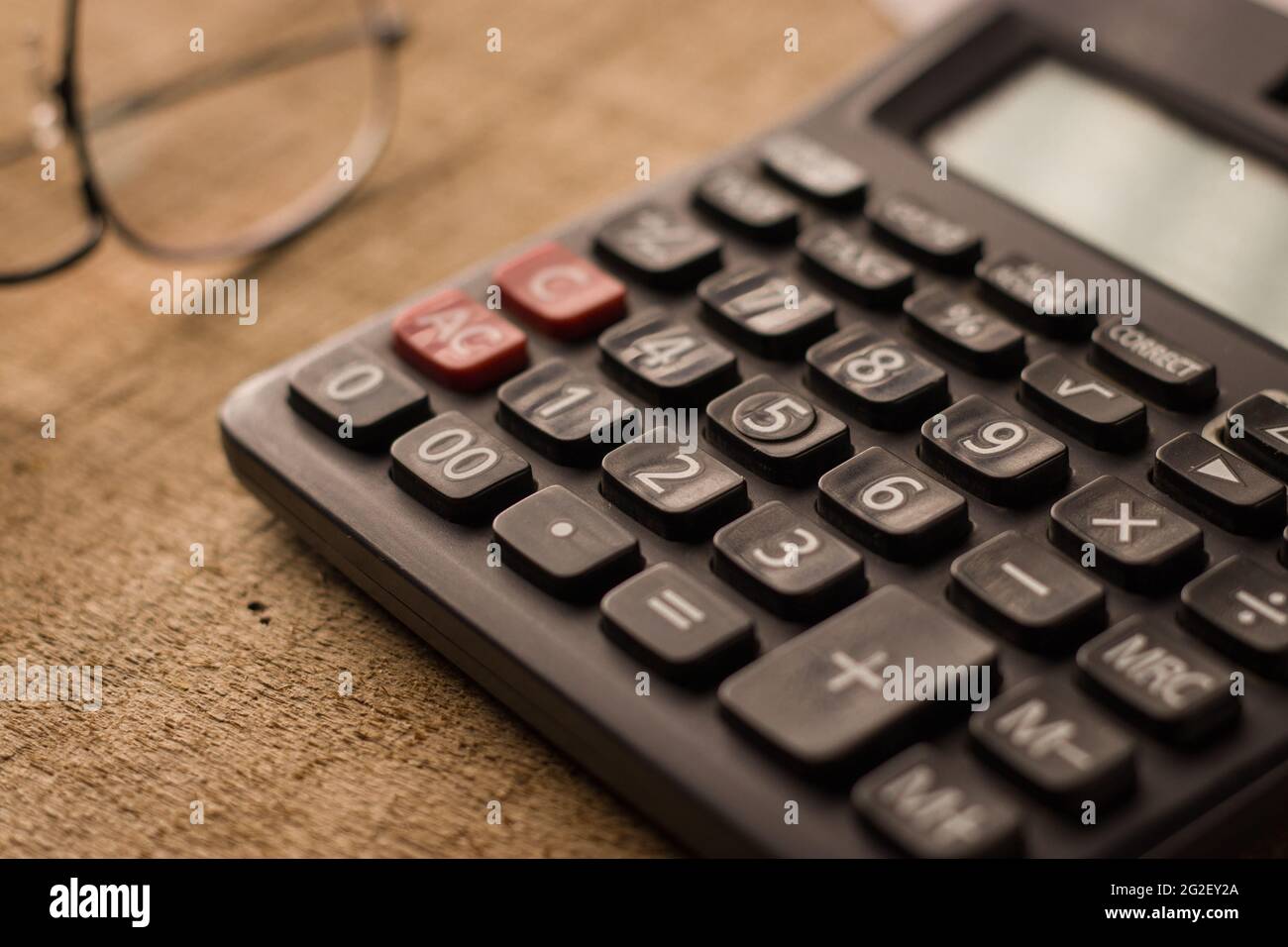 Black calculator on texture background stock image Stock Photo - Alamy