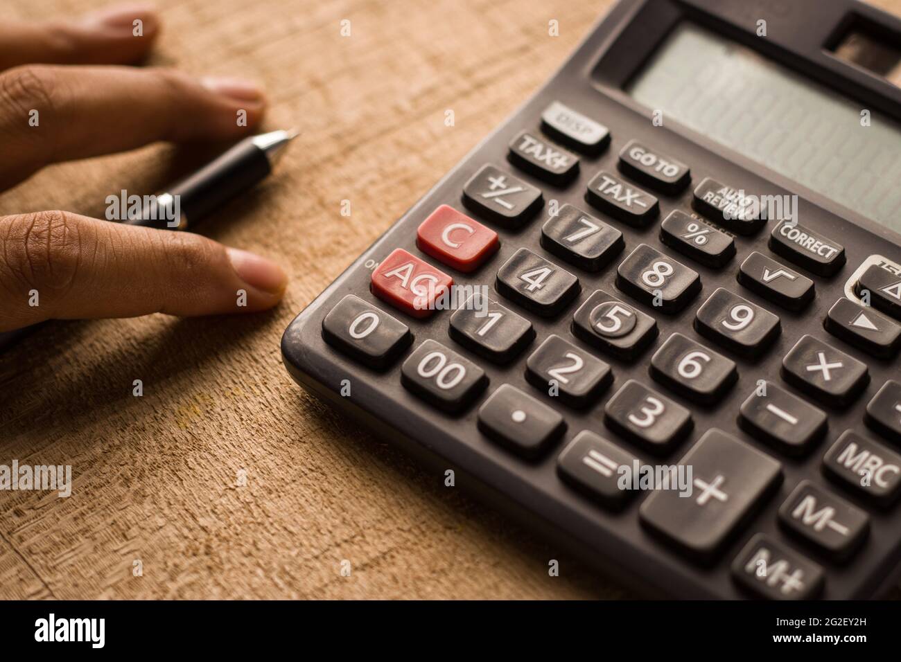 Black calculator on texture background stock image Stock Photo - Alamy