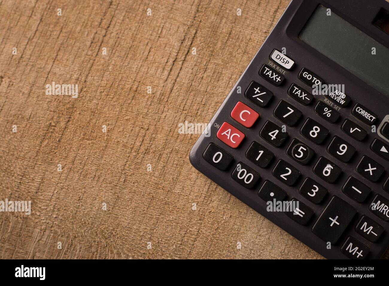 Black calculator on texture background stock image Stock Photo - Alamy