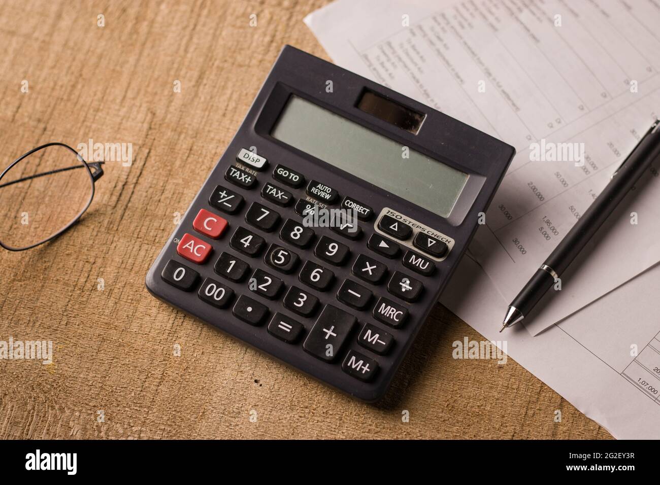 Black calculator on texture background stock image Stock Photo - Alamy