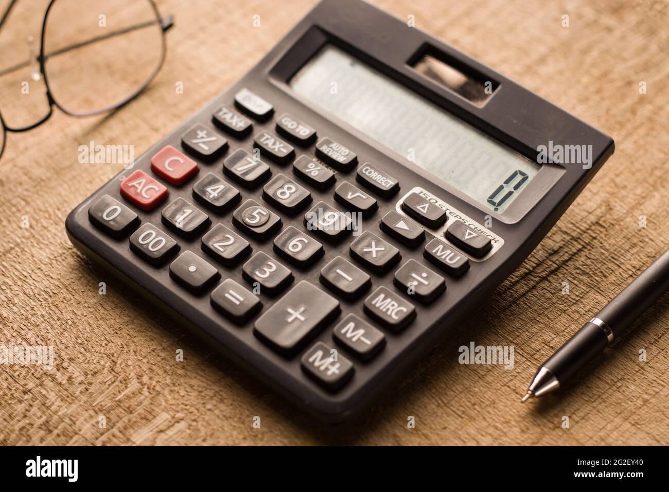 Black calculator on texture background stock image Stock Photo - Alamy