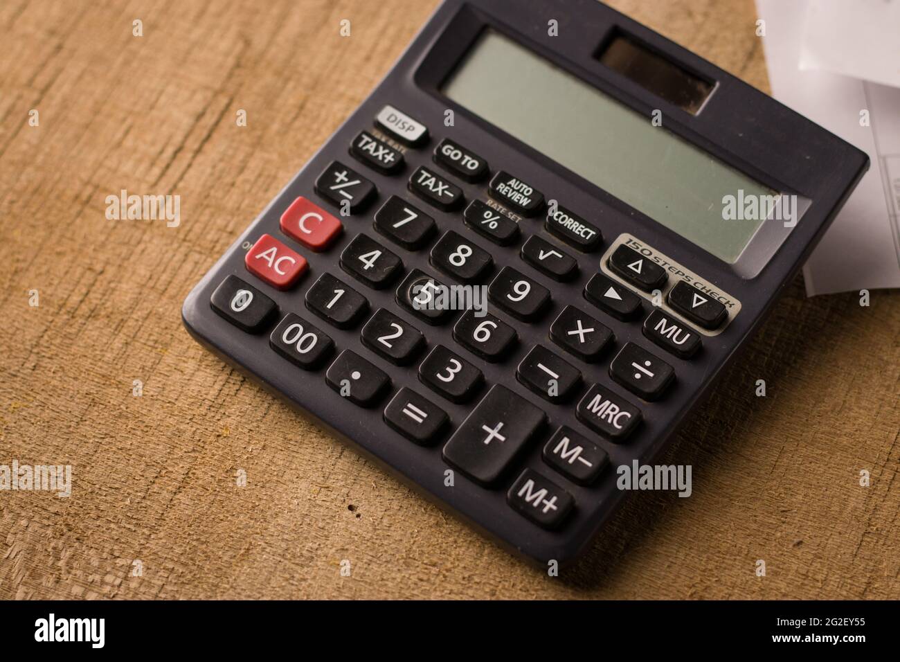 Black calculator on texture background stock image Stock Photo - Alamy