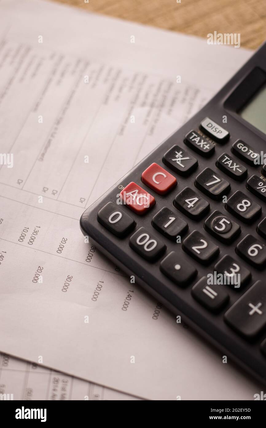 Black calculator on texture background stock image Stock Photo - Alamy
