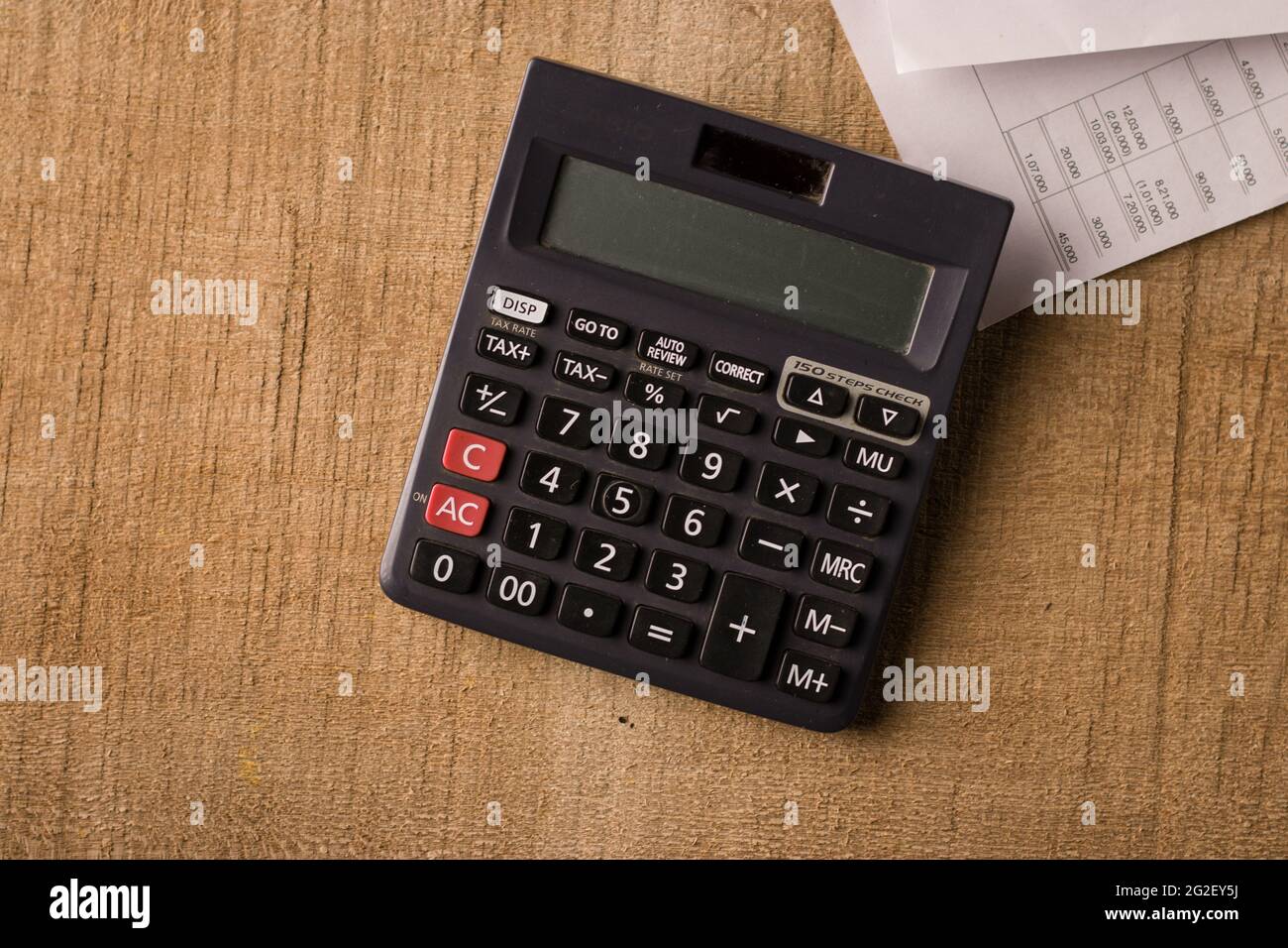 Black calculator on texture background stock image Stock Photo - Alamy