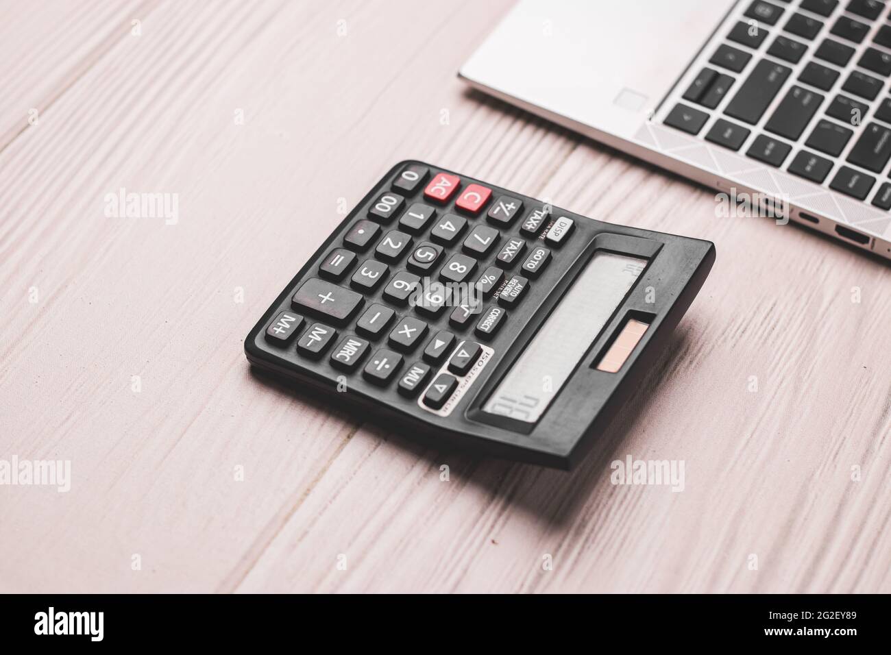 Black calculator on texture background stock image Stock Photo - Alamy