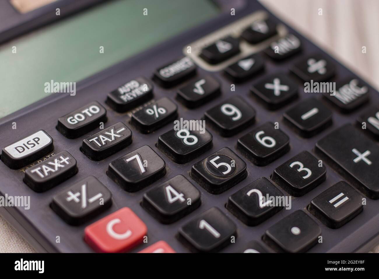 Black calculator on texture background stock image Stock Photo - Alamy