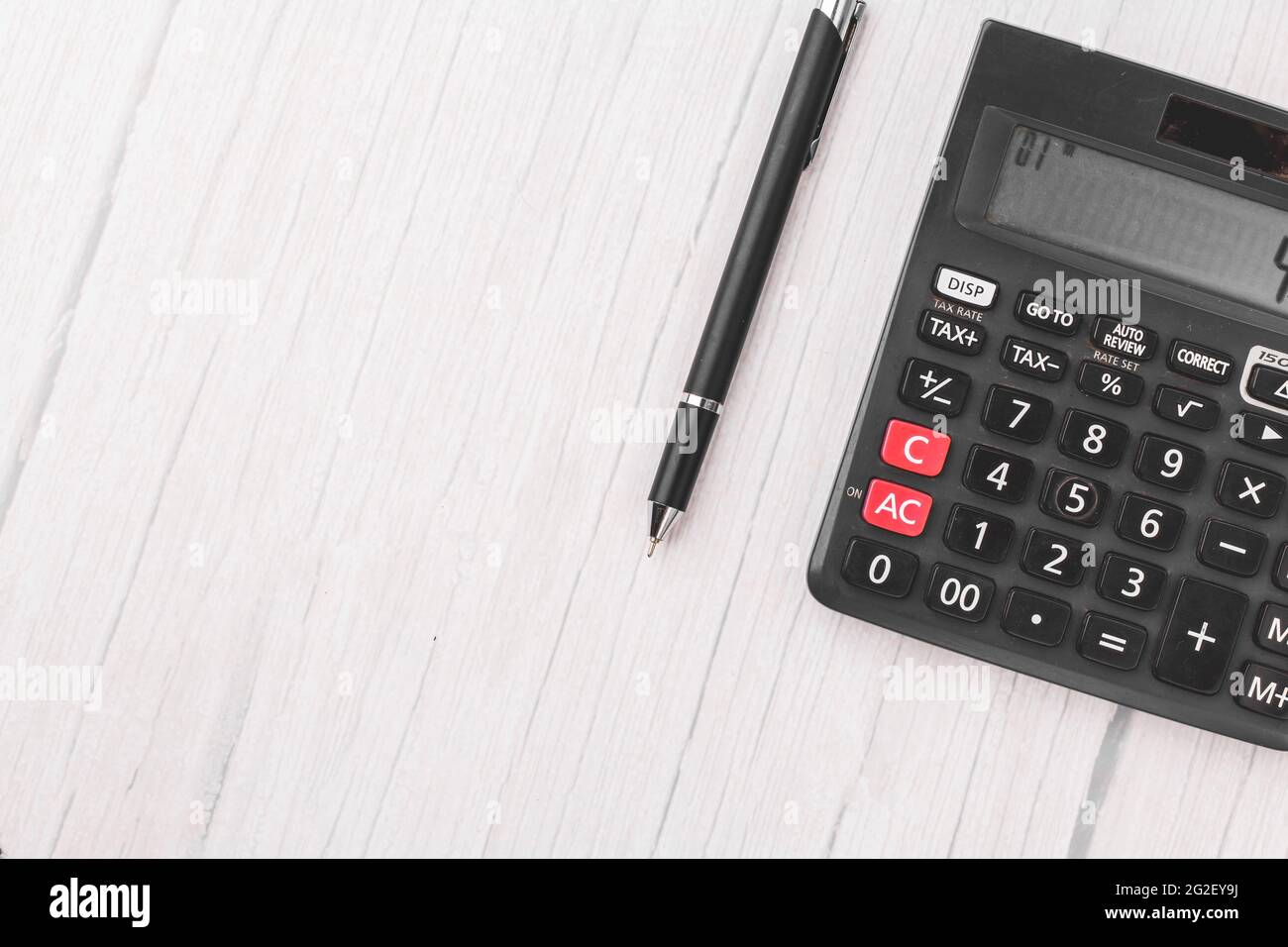 Black calculator on texture background stock image Stock Photo - Alamy