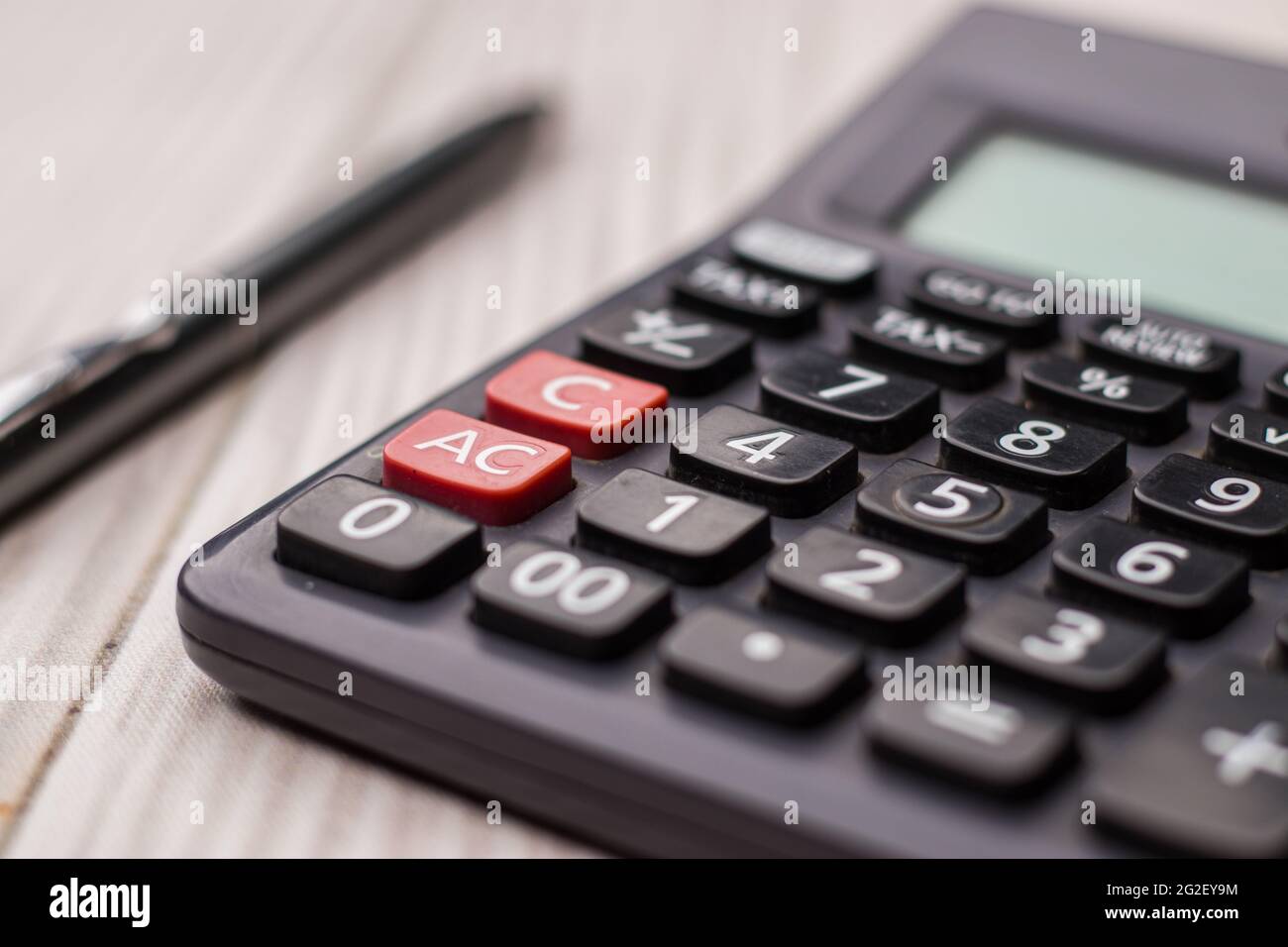 Black calculator on texture background stock image Stock Photo - Alamy