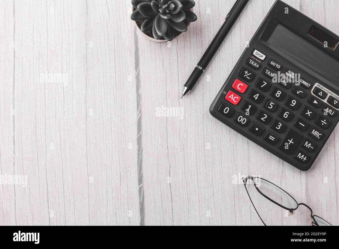 Black calculator on texture background stock image Stock Photo - Alamy