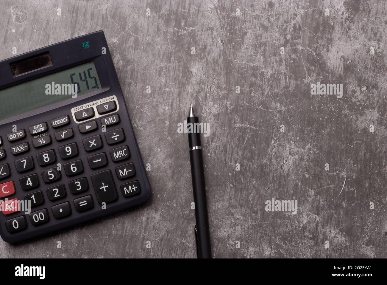 Black calculator on texture background stock image Stock Photo - Alamy