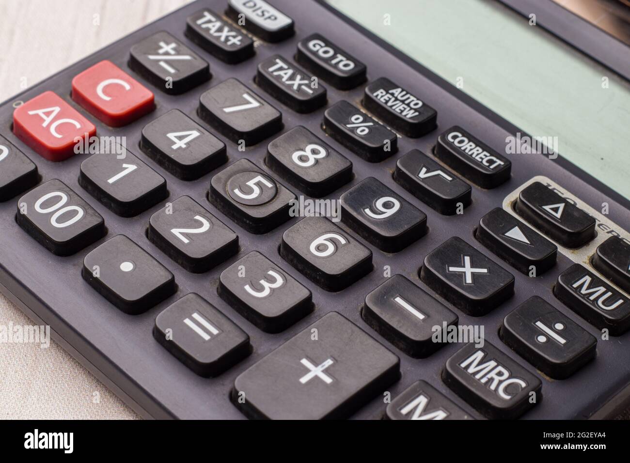 Black calculator on texture background stock image Stock Photo - Alamy