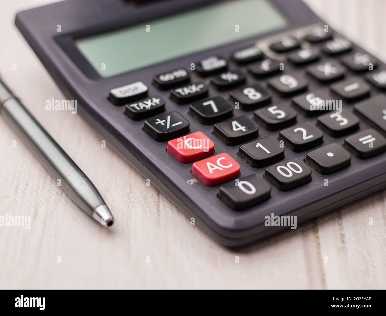 Black calculator on texture background stock image Stock Photo - Alamy