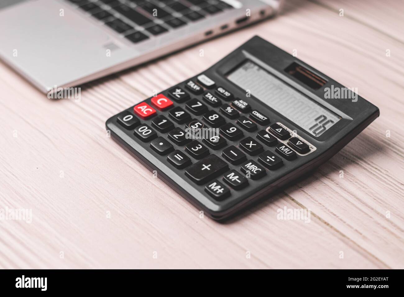 Black calculator on texture background stock image Stock Photo - Alamy