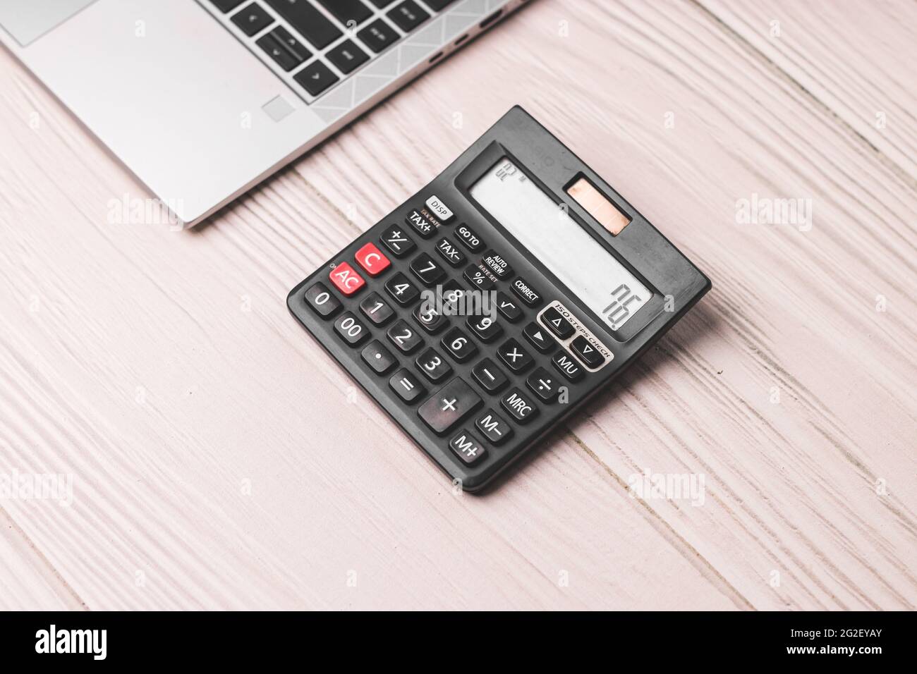 Black calculator on texture background stock image Stock Photo - Alamy