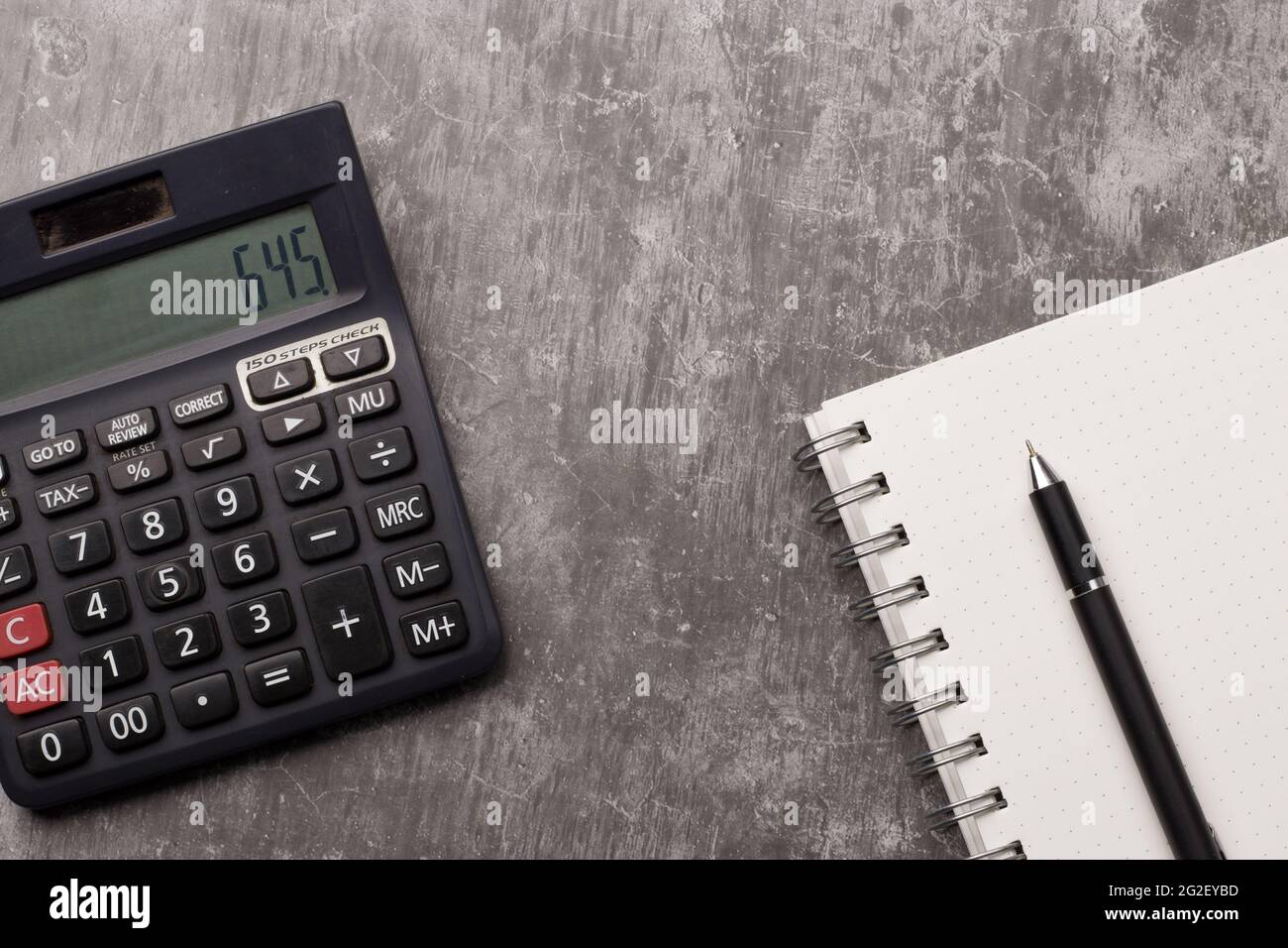 Black calculator on texture background stock image Stock Photo - Alamy