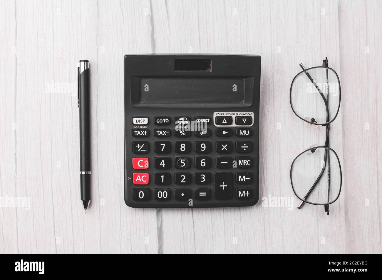 Black calculator on texture background stock image Stock Photo - Alamy