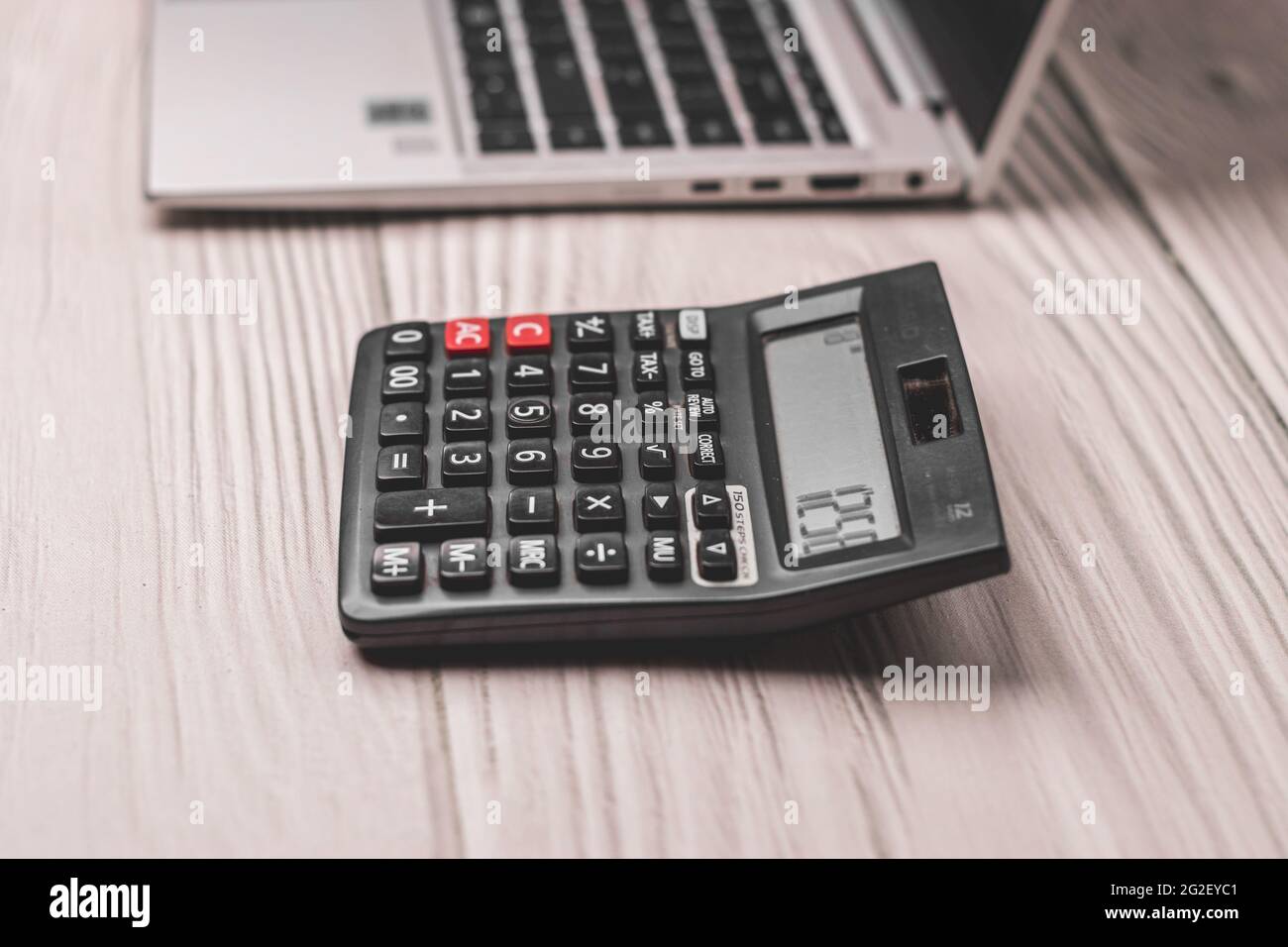 Black calculator on texture background stock image Stock Photo - Alamy