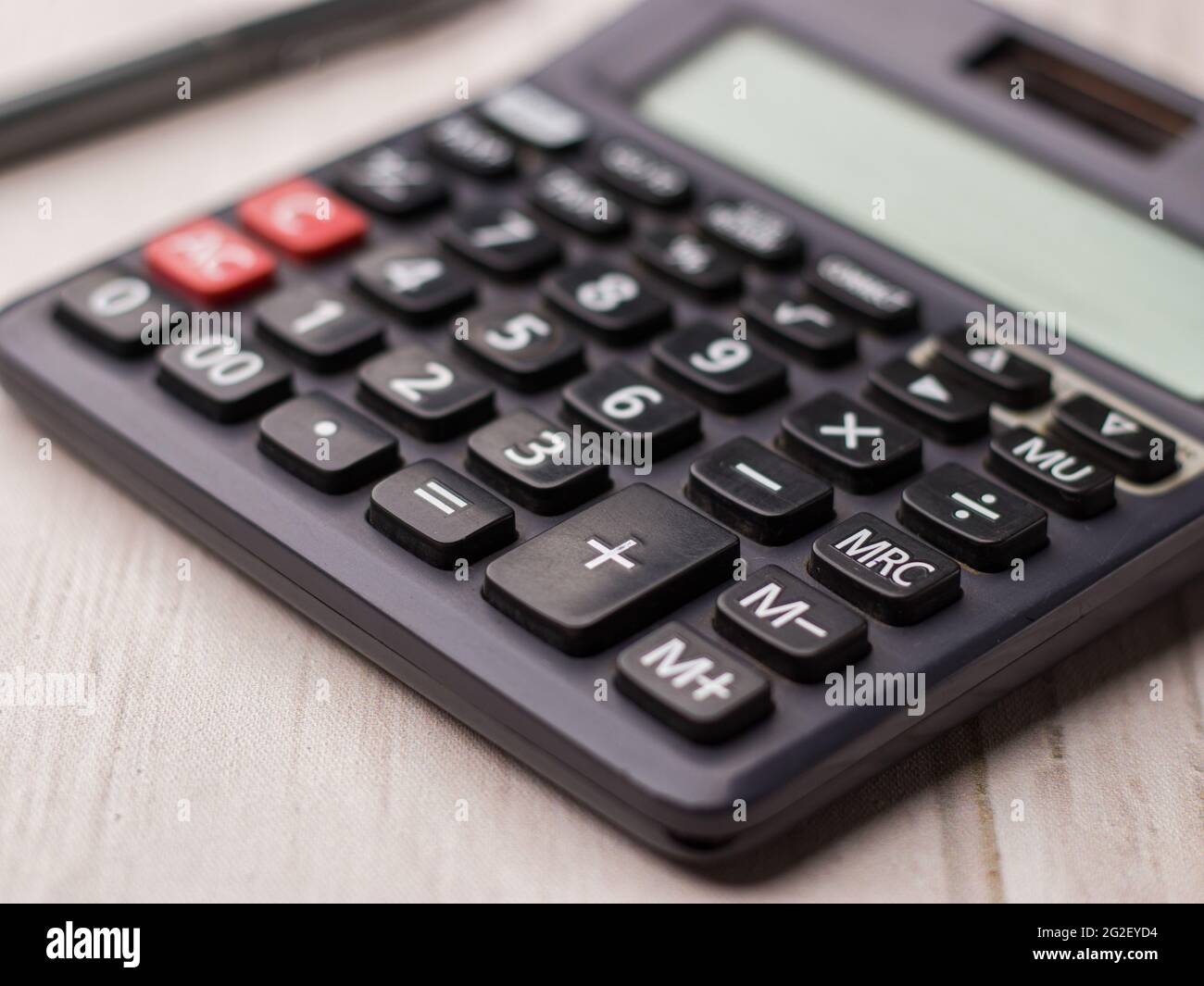 Black calculator on texture background stock image Stock Photo - Alamy