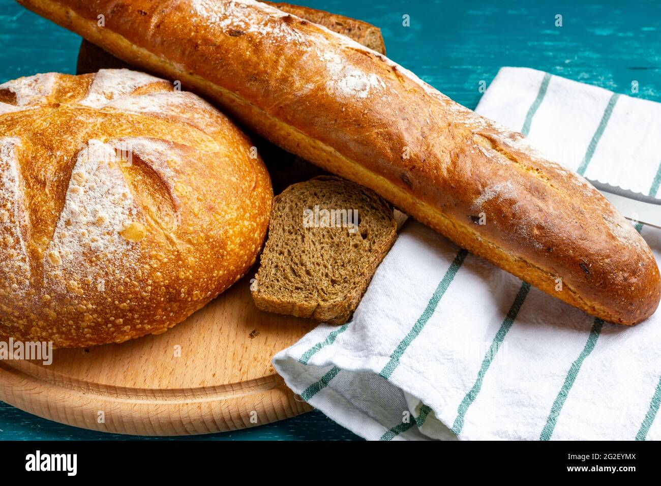 Bakery products. Fresh bread. Round loaf of bread, baguette on a ...
