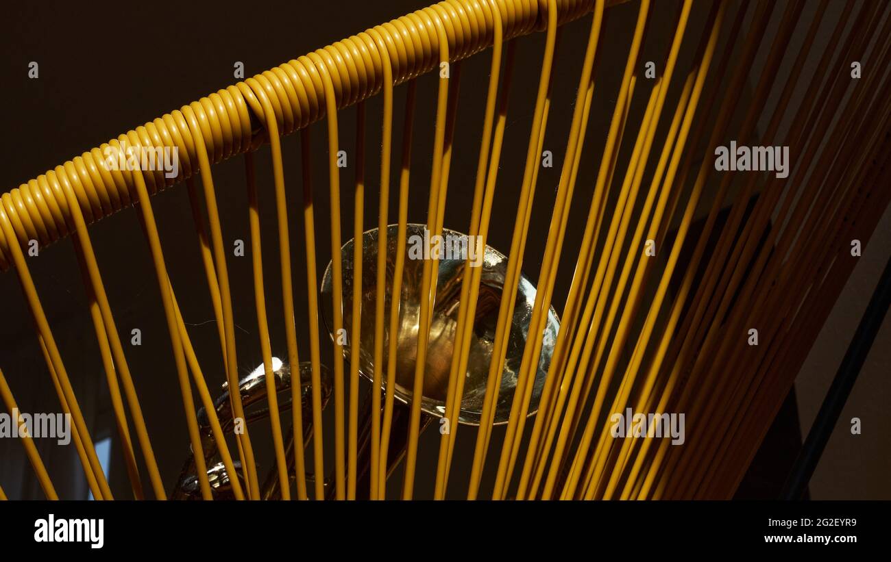 Trumpet details and a design chair Stock Photo - Alamy