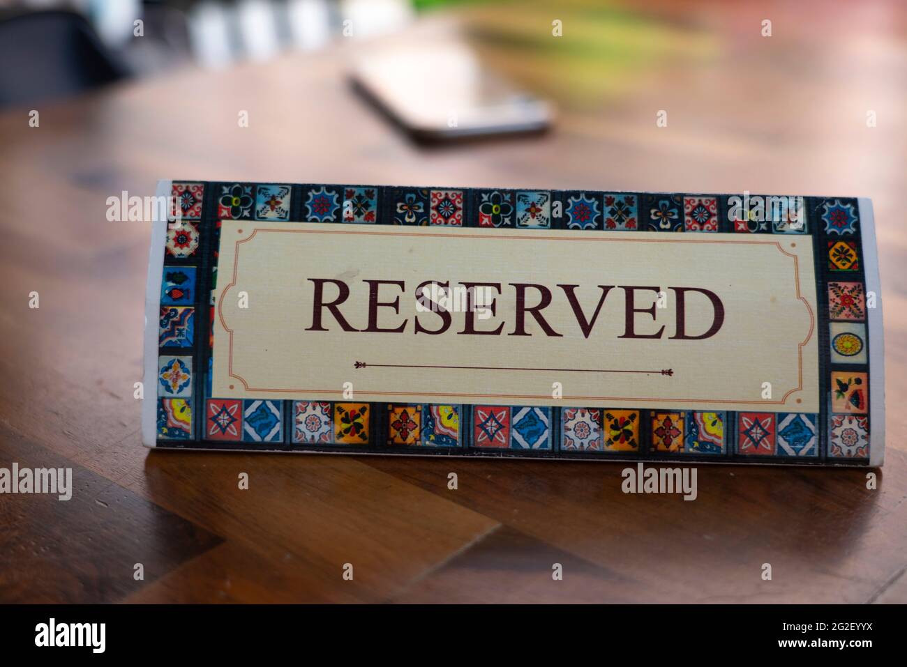 Sign "Reserve" on a table in a cafe Stock Photo - Alamy
