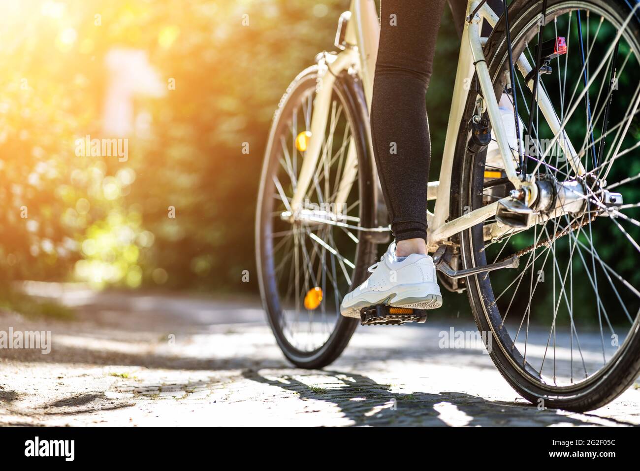 Lady riding bike hi-res stock photography and images - Alamy