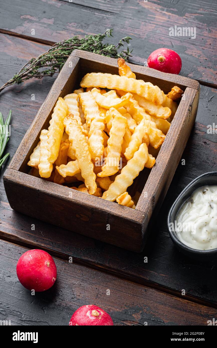Homemade Baked Potato set, in wooden box, on old dark wooden table ...