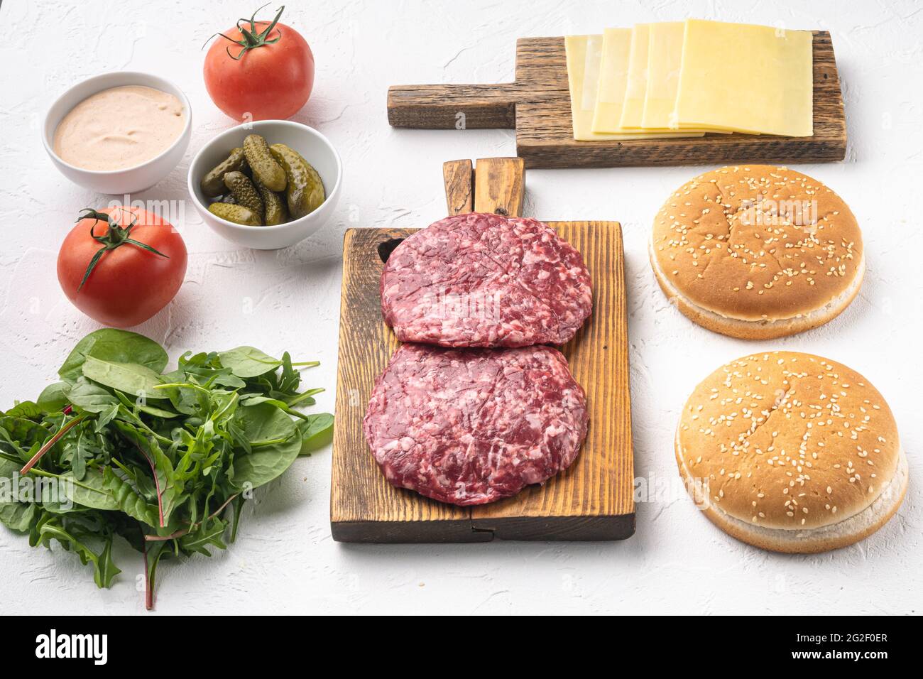 Burger banner. Raw ingredients for burger set, on white stone ...