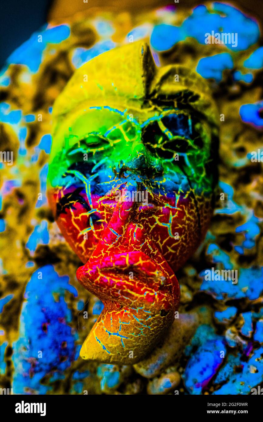 A Bali face mask with finger on its mouth Stock Photo - Alamy