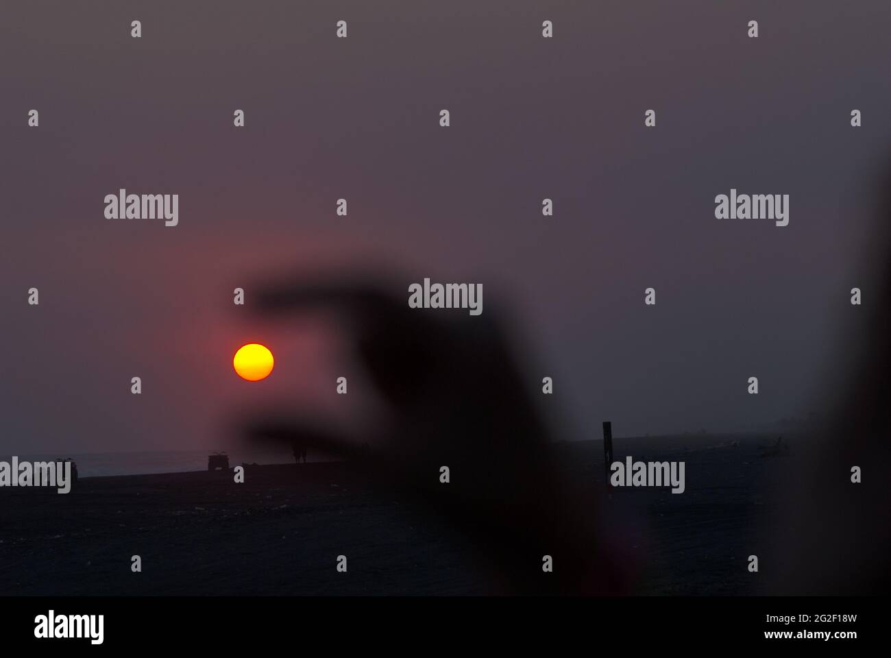 Sunset on Guatemala beach, black volcanic sand Stock Photo - Alamy