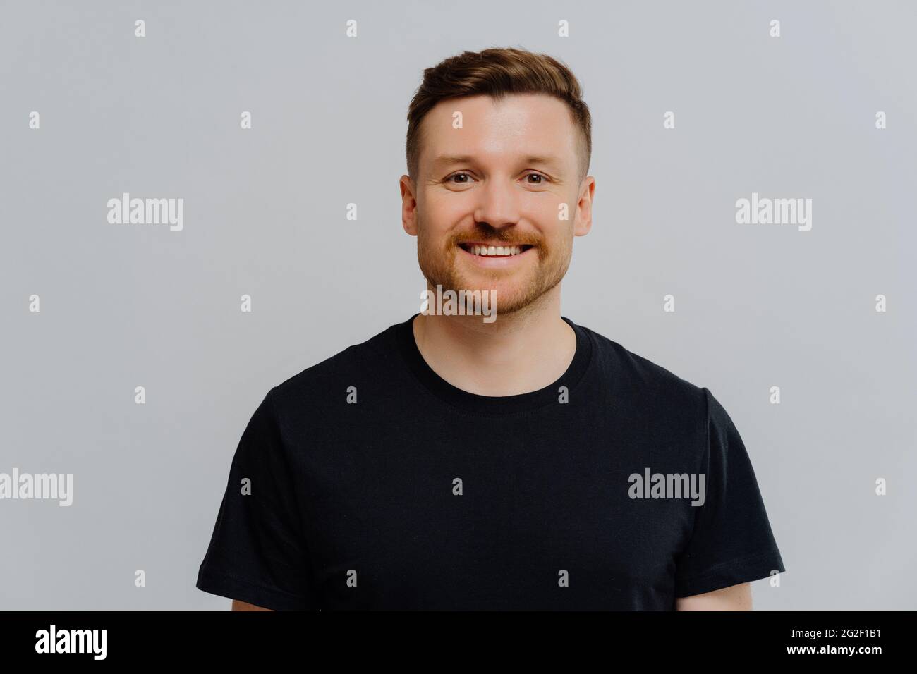 Friendly attractive young man looking at camera hi-res stock ...