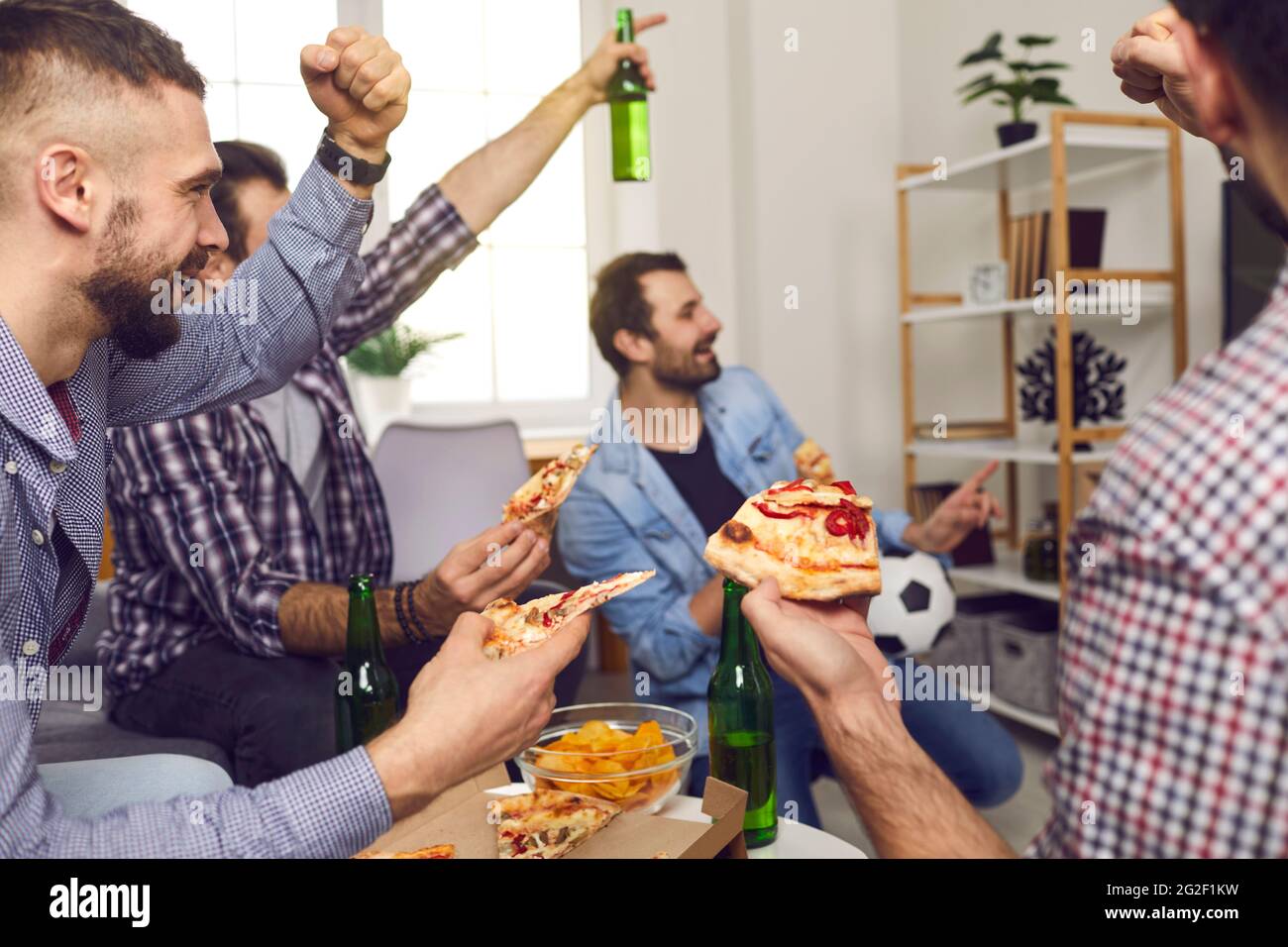 Man cheering for a game on tv hi-res stock photography and images - Alamy