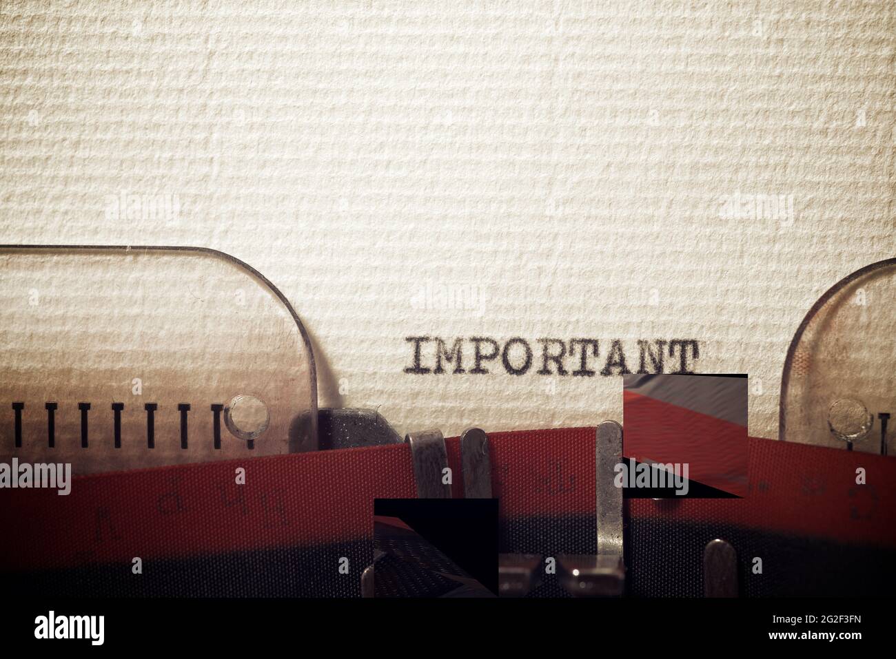 The word important written with a typewriter Stock Photo - Alamy