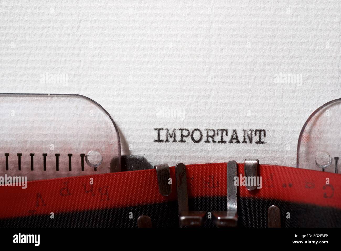 The word important written with a typewriter Stock Photo - Alamy