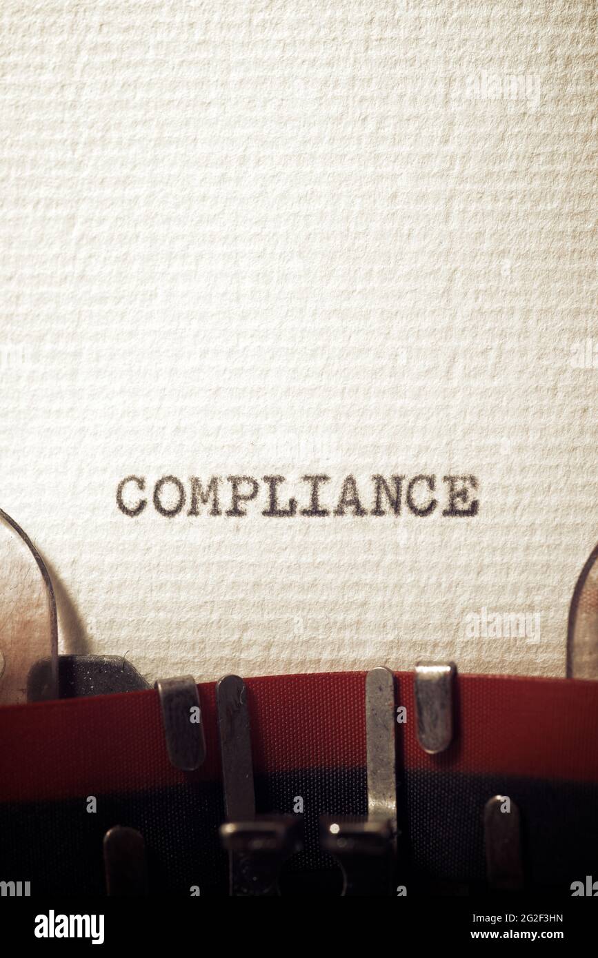 The word compliance written with a typewriter Stock Photo - Alamy