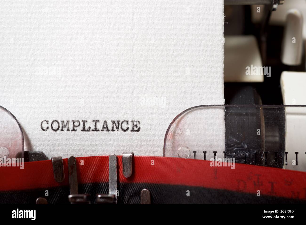 The word compliance written with a typewriter Stock Photo - Alamy