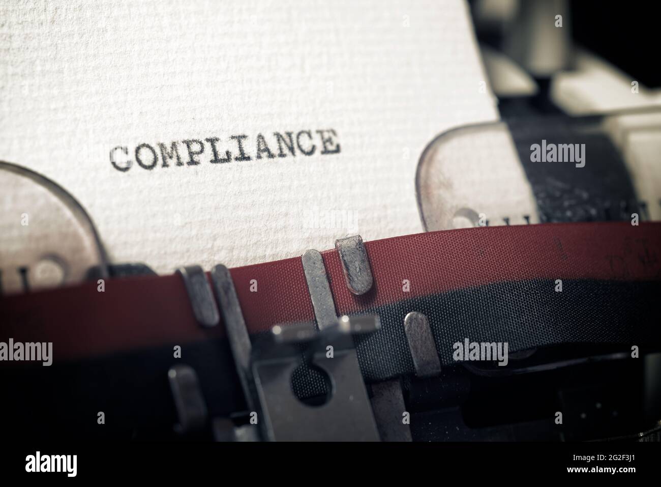 The word compliance written with a typewriter Stock Photo - Alamy