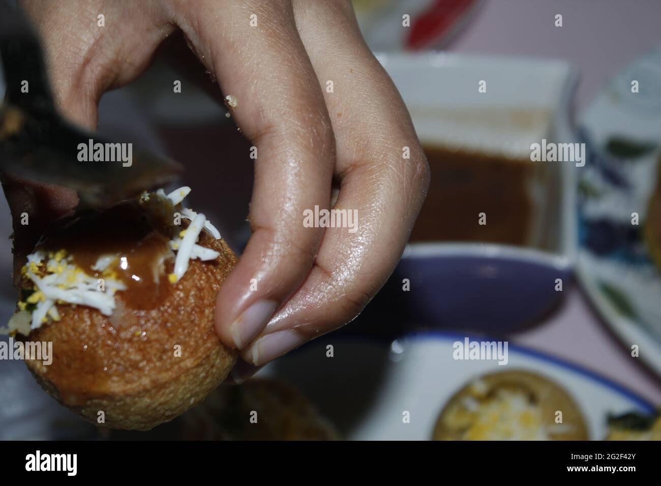 A picture of someone holding a fuska Stock Photo - Alamy