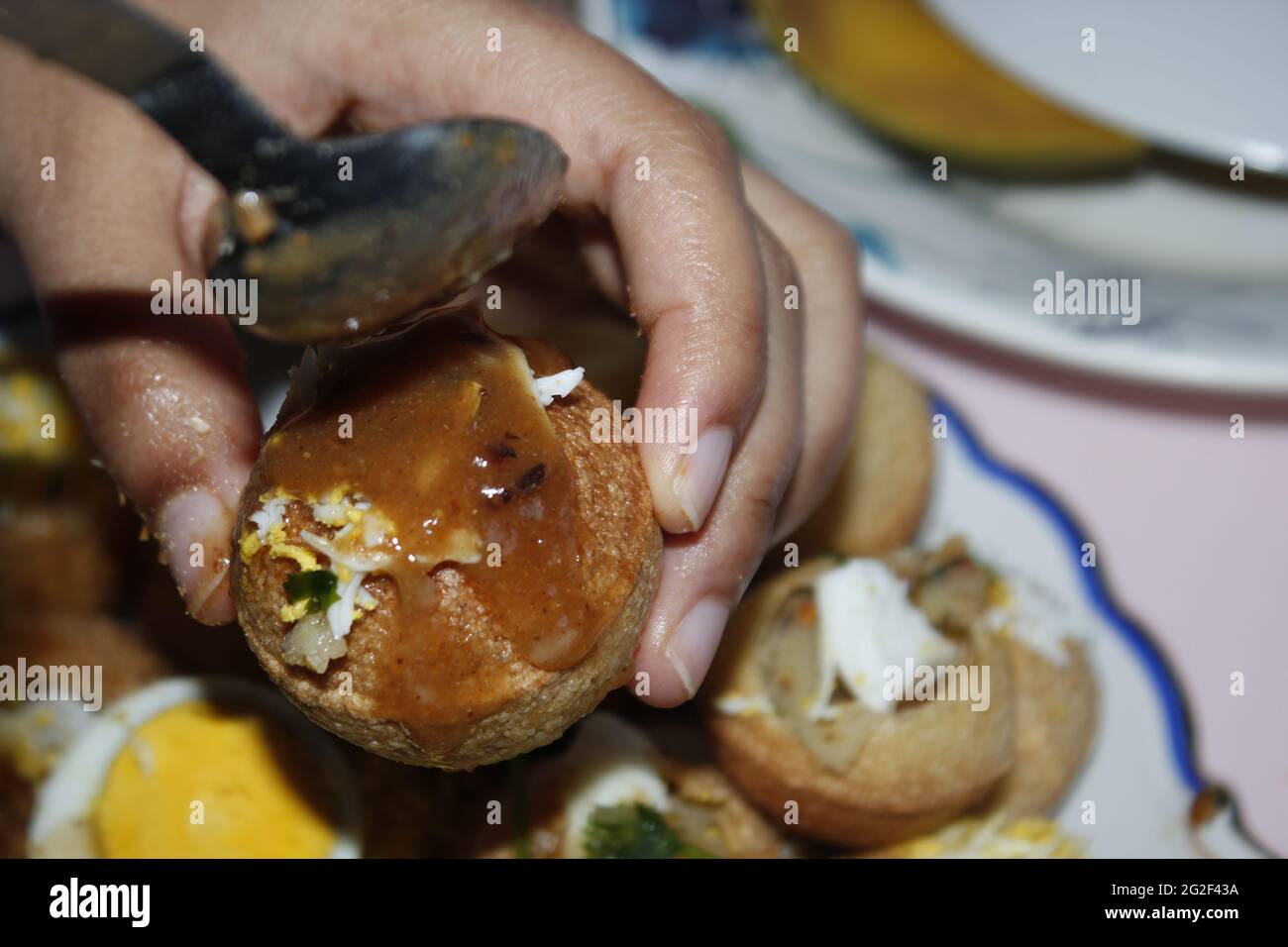 A picture of someone holding a fuska Stock Photo - Alamy
