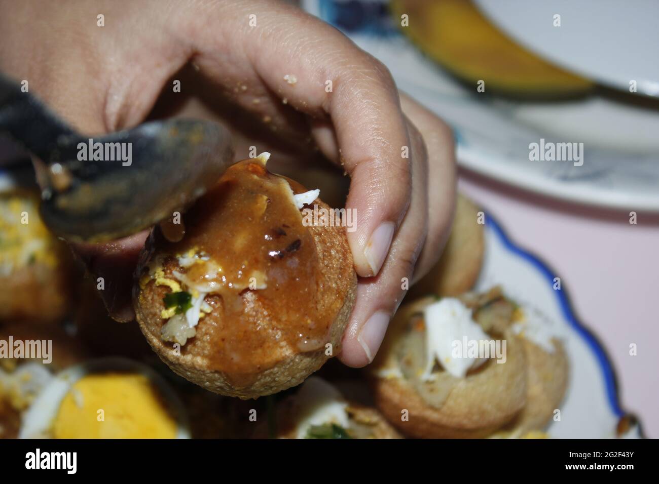 A picture of someone holding a fuska Stock Photo - Alamy