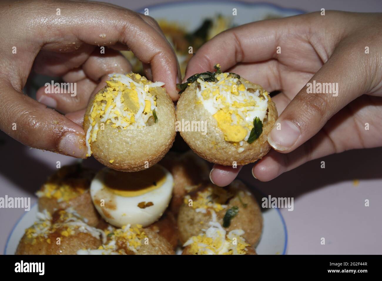 A picture of someone holding a fuska Stock Photo - Alamy