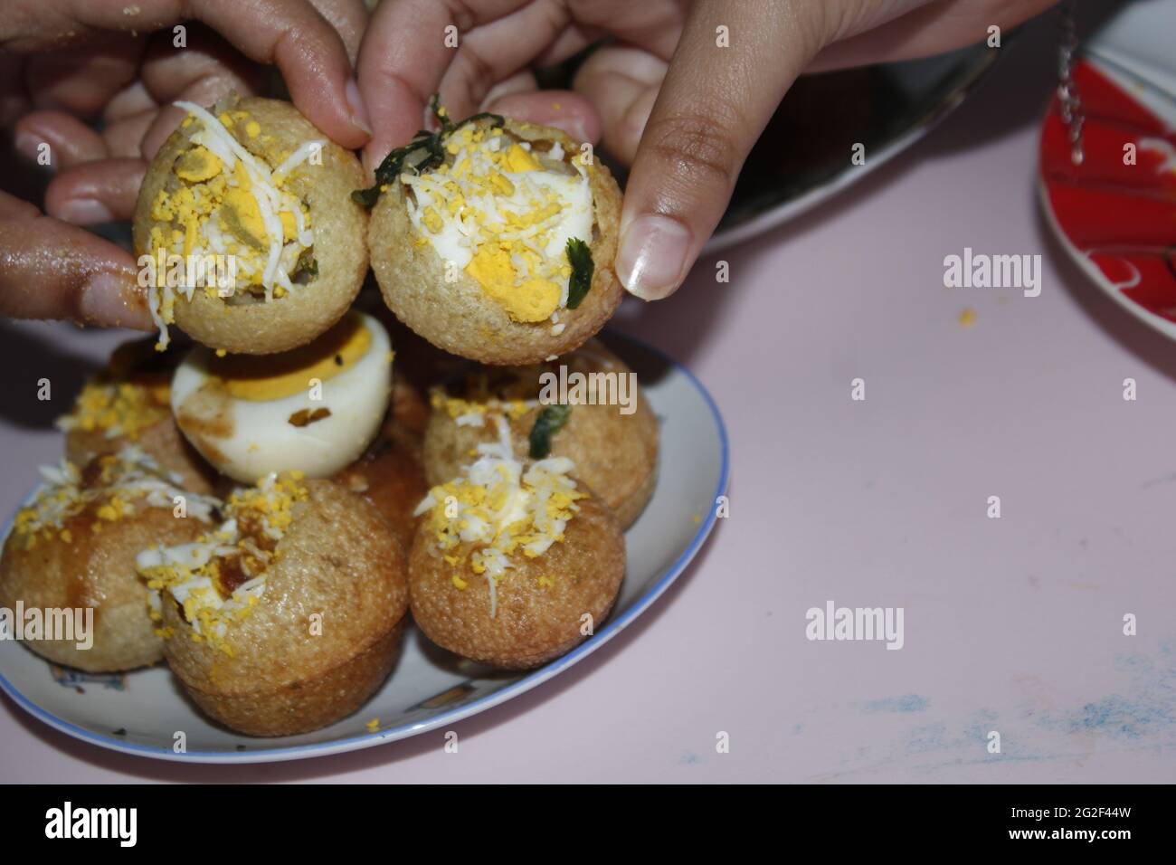 A picture of someone holding a fuska Stock Photo - Alamy