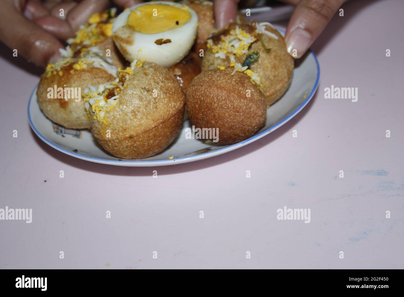 A picture of someone holding a fuska Stock Photo - Alamy