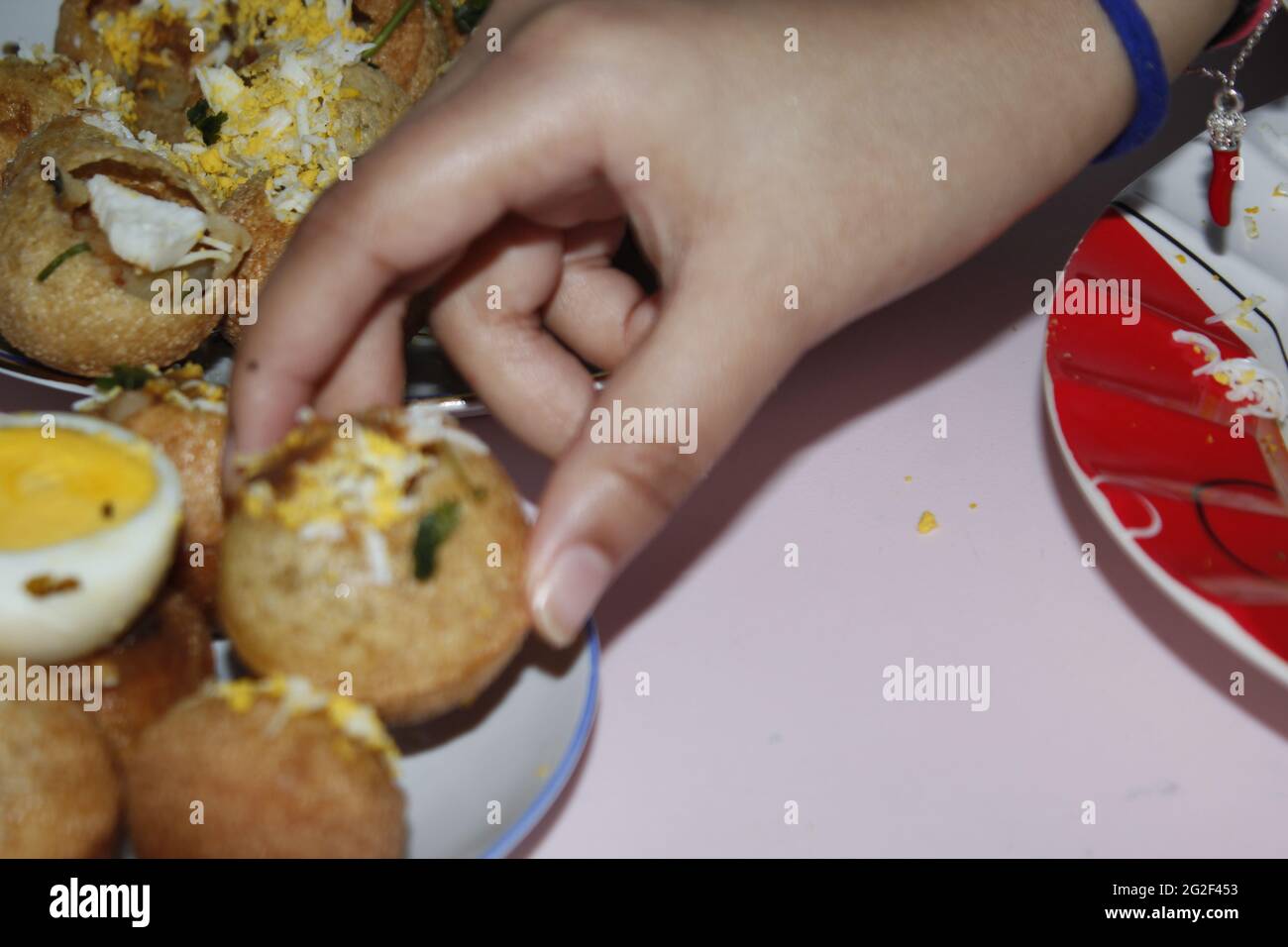 A picture of someone holding a fuska Stock Photo - Alamy