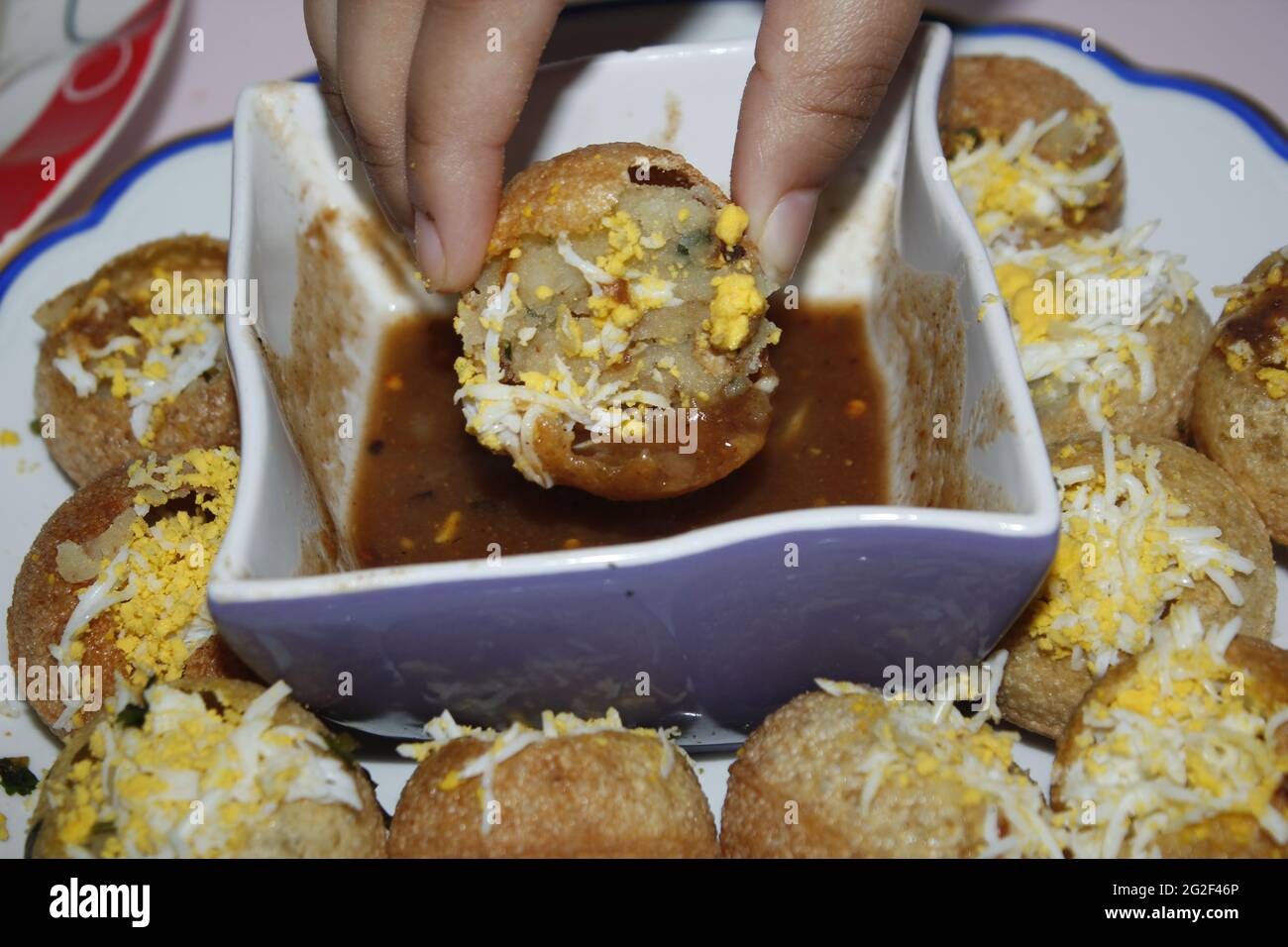 A picture of someone holding a fuska Stock Photo - Alamy